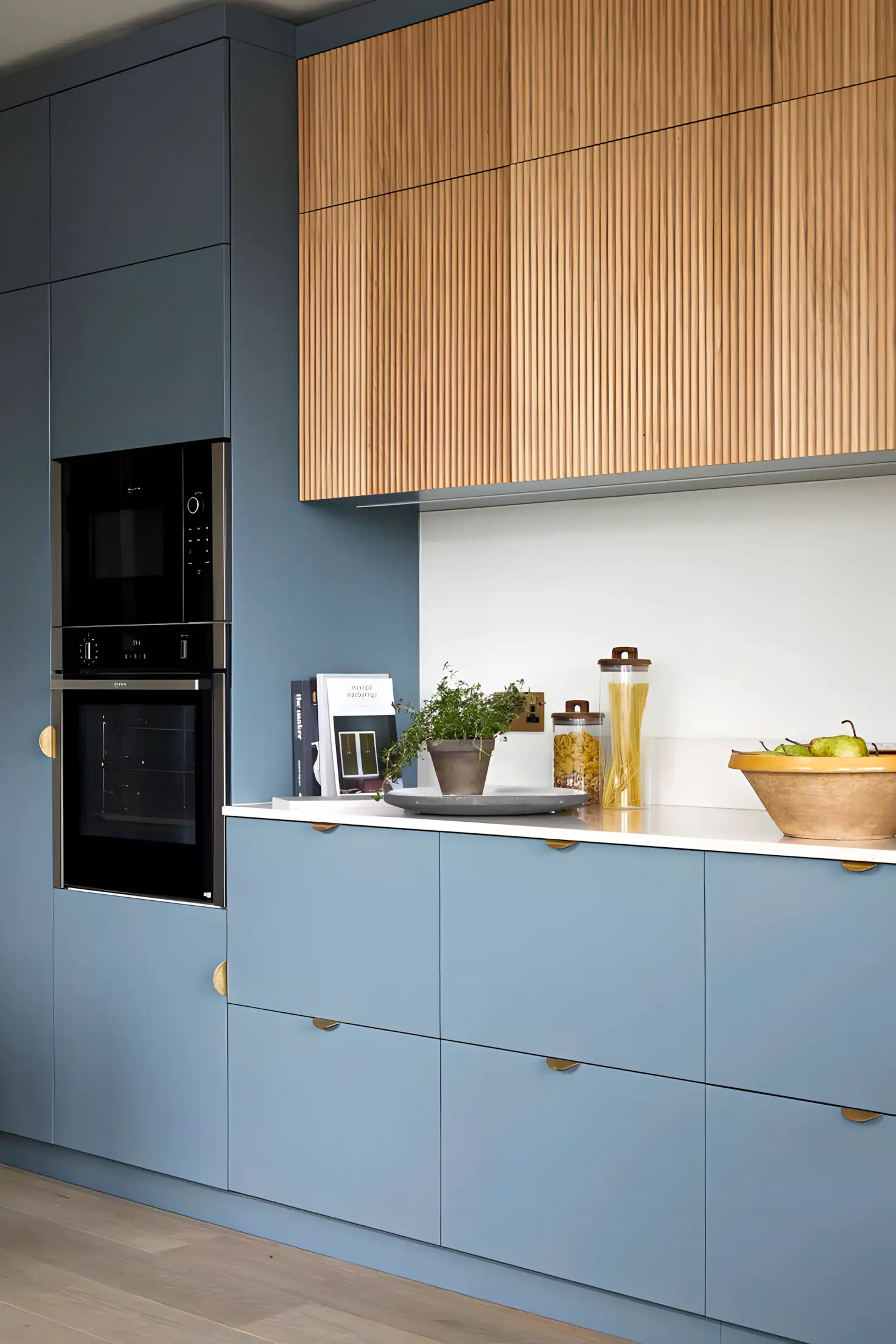 Contemporary Kitchen with Blue Cabinets and Fluted Wood Accents