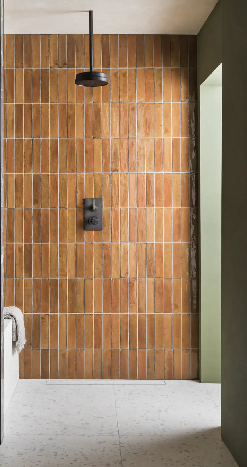 Title: "Earthy Terracotta Vertical Tiles in Minimalist Shower Design"